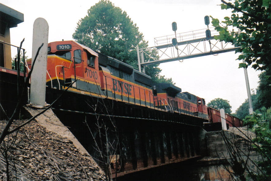 BNSF 7010 follows UP 7275 across this bridge